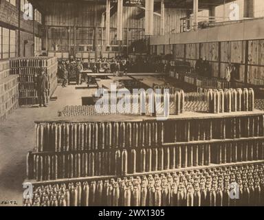 Manufacturing high explosive shells. High explosive shells ready to be ...