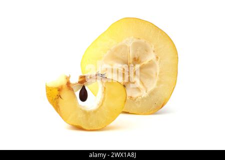 Vibrant quince fruits, both sliced and whole isolated on white ...
