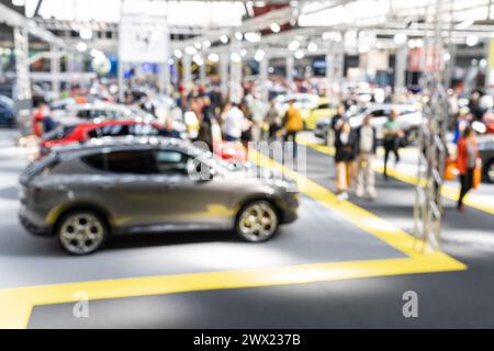 Blurred background of car show exposition Stock Photo - Alamy