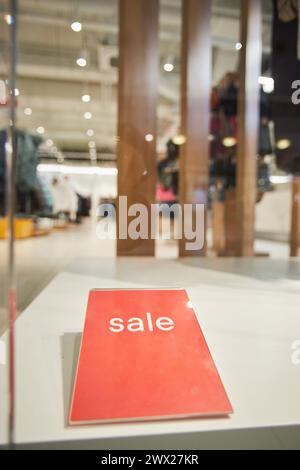 Storefront window display with sale sign and mannequins. London, UK, 24 ...