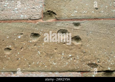 English civil war musket shot marks on the wall of St Peter's church ...