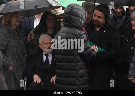 Marion Coyle, hands the folded tricolour removed from the casket of ...