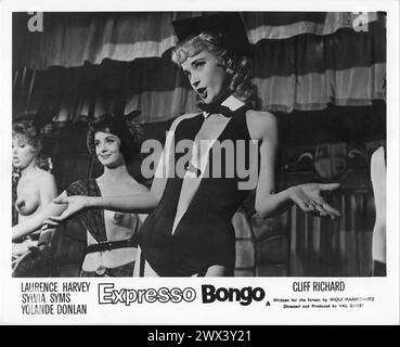 SYLVIA SYMS and dancing girls in a scene from EXPRESSO BONGO 1959 also starring LAURENCE HARVEY ...