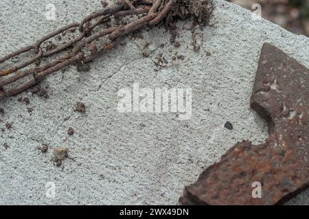 Abstract of Lumberman tools with broken rusted axe, head, chain on a ...