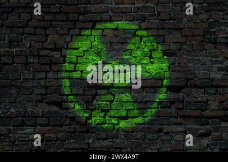 Radioactive sign on brick wall, space for text. Hazard symbol Stock ...