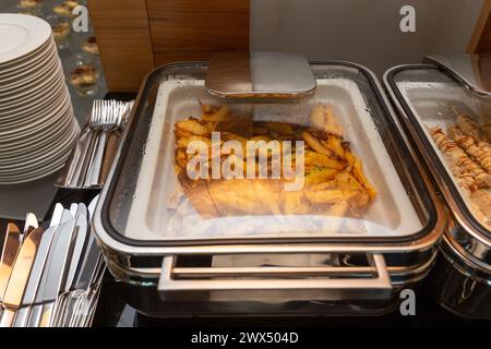 Buffet table with dishware waiting for guests Stock Photo - Alamy