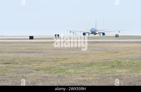 A KC-46A Pegasus with Wing Aerial Refueling Pods attached takes off ...