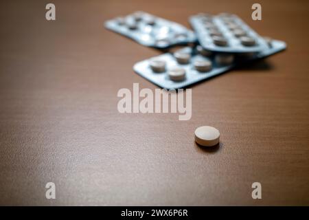 Cream tablets pills drugs on wooden table. Medicine concept Stock Photo ...