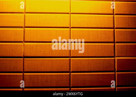 An ambient night glow transforms a brick wall into an illuminated ...