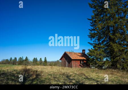 Small traditional Swedish house near the frozen Kottla lake in Lidingö ...