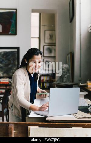Female architect using computer at home Stock Photo - Alamy