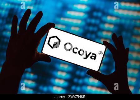 In this photo illustration, the Ocoya AI logo is displayed on a ...