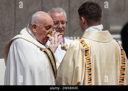 Pope Francis takes the holy communion during the Chrism Mass at St ...