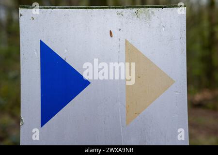 Directional arrows on metal plate Stock Photo - Alamy