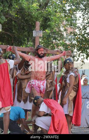 Actors perform in a Way of the Cross reenactment as part of Holy Week ...