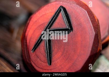 Rune Raido red color carved from wood on a wooden background - Elder ...