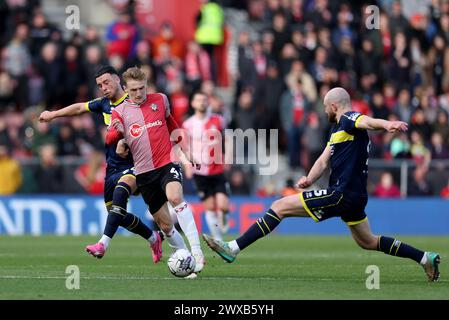 Southampton's Flynn Downes (left) and Middlesbrough's Morgan Whittaker ...