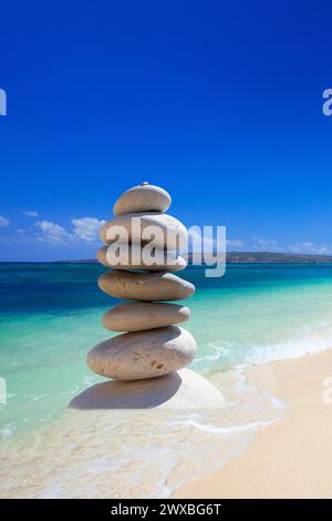 Pebble tower on the beach, Seychelles Stock Photo - Alamy