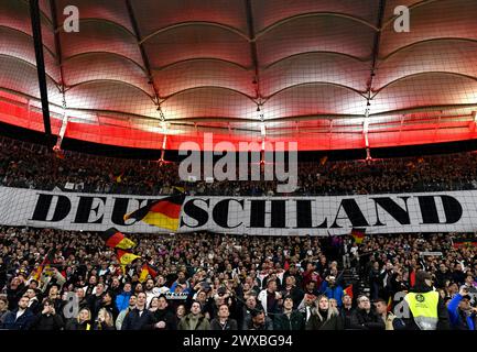 Germany fans sing their national anthem and wave flags before the World ...