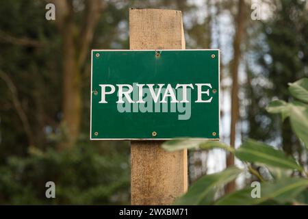 CAUTION text written on green zig-zag stamp sign Stock Photo - Alamy