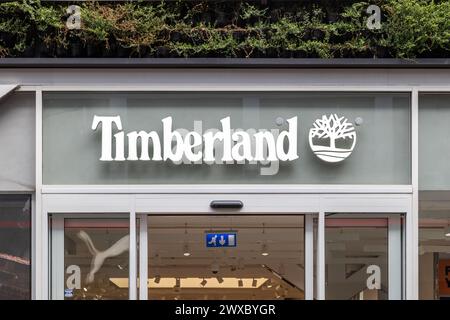 Detail of the signage branding and logo of a Timberland store. Detail ...