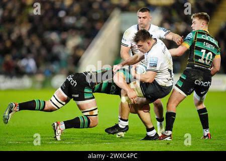 Saracens' Theo Dan is tackled by Northampton Saints' Fin Smith during ...