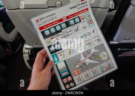 airplane safety briefing and instruction card Stock Photo - Alamy