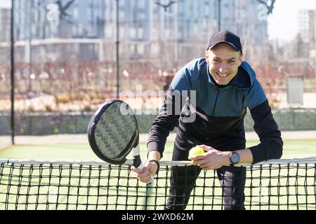paddle player resting against the wall entertained by the ball Stock ...
