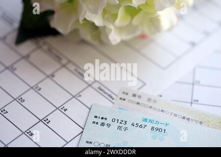 Japanese my number card specimen and notification card on calendar ...