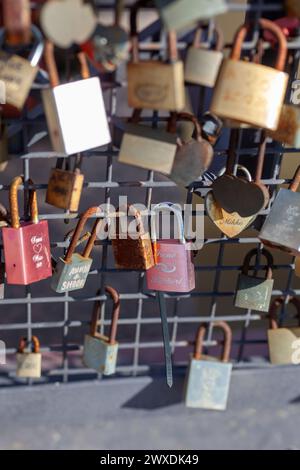 Love lock bridge at Katajanokka with many locks. Couples putting locks ...
