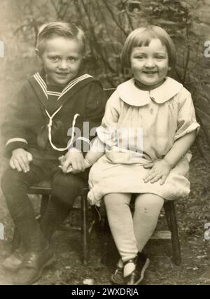 Classic photograph of children sister siblings in both primary and ...