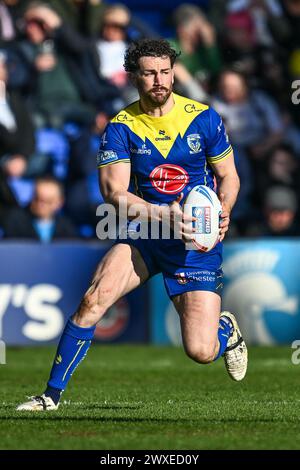 Toby King of Warrington Wolves makes a break during the Betfred Super ...