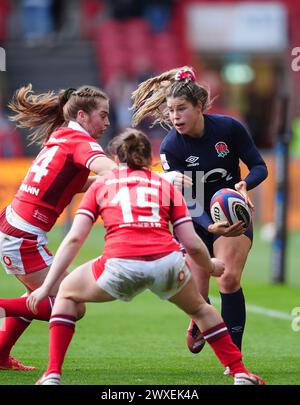 England’s Jess Breach (right) is tackled by Wales’ Kayleigh Powell ...