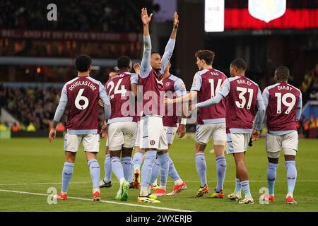 Aston Villa's Ezri Konsa (centre) celebrates scoring their side's third ...