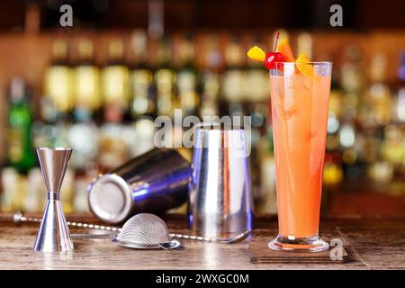 Working tool of the bartender and a prepared cocktail on the bar in the ...