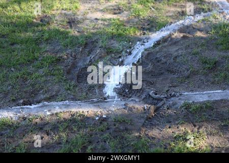 Corner quadrant of football pitch showing pitch markings and mud muddy ...