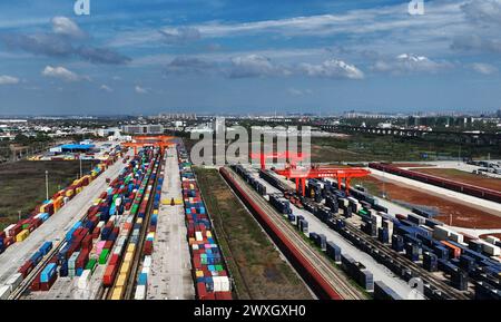 NANCHANG, CHINA - MARCH 31, 2024 - A gantry crane is lifting containers ...