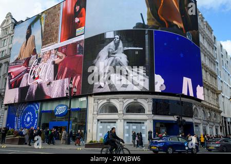 Digital advertising billboards in Piccadilly Circus, London with red ...