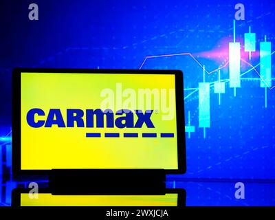 In this photo illustration, the CarMax company logo is seen displayed ...