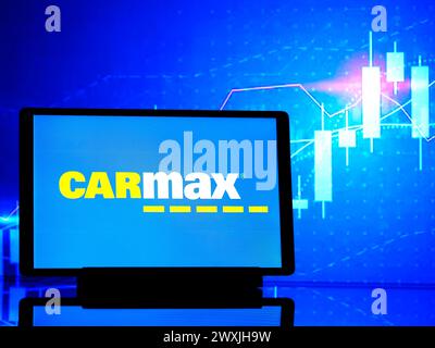 In this photo illustration, the CarMax company logo is seen displayed ...