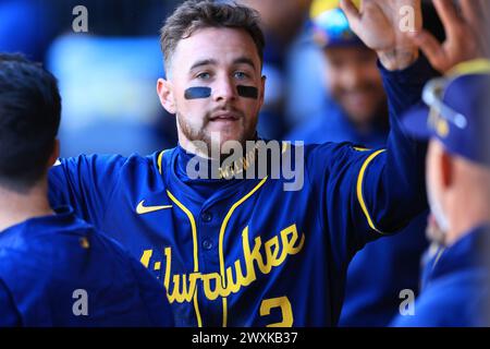 Milwaukee Brewers' Brice Turang is congratulated after hitting a two ...