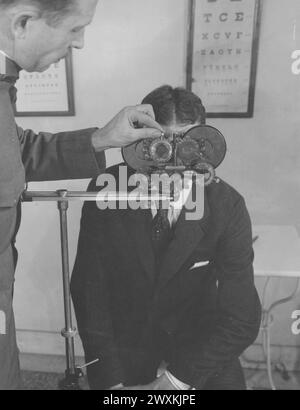 Original caption: Physical examination of aviation recruit at Episcopal ...