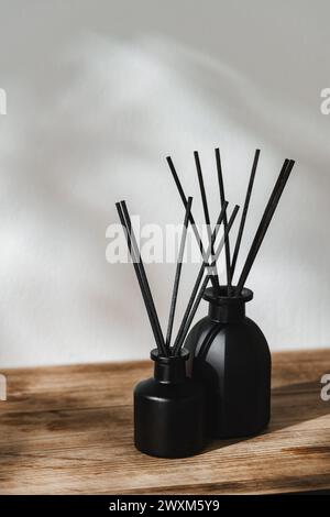 Minimalist Aromatic Reed Diffusers on a Wooden Surface Against a Soft ...