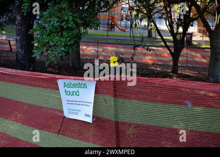 Hazard fencing around garden beds and trees in Cook & Philip park. The ...