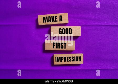 Make a good first impression words written on wooden blocks with pink ...
