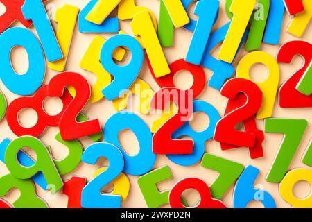 Colorful numbers on beige background, flat lay Stock Photo - Alamy