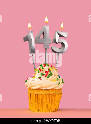 Birthday card with number 145 candle - Cupcake on a green background ...
