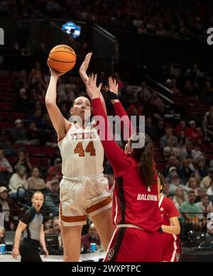 Texas forward Taylor Jones (44) and guard Jordana Codio (13) walk off ...