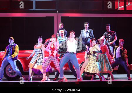 The cast of the musical Grease perform live on stage at West End Live ...