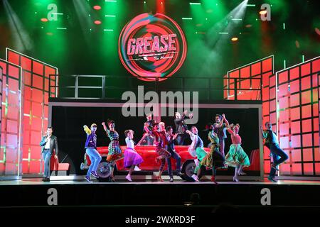 The cast of the musical Grease perform live on stage at West End Live ...